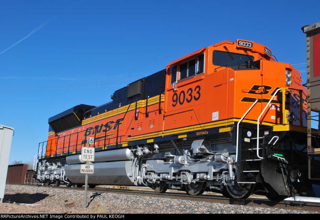 BNSF 9033 is a Rear DPU on a Loaded Coal Train waiting to Enter the BNSF Lincoln Yard.